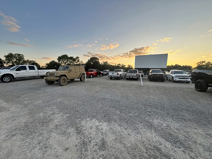 Sunset magic at Capri Drive-In! Cars line up like eager moviegoers from decades past, ready for that perfect summer night experience.
