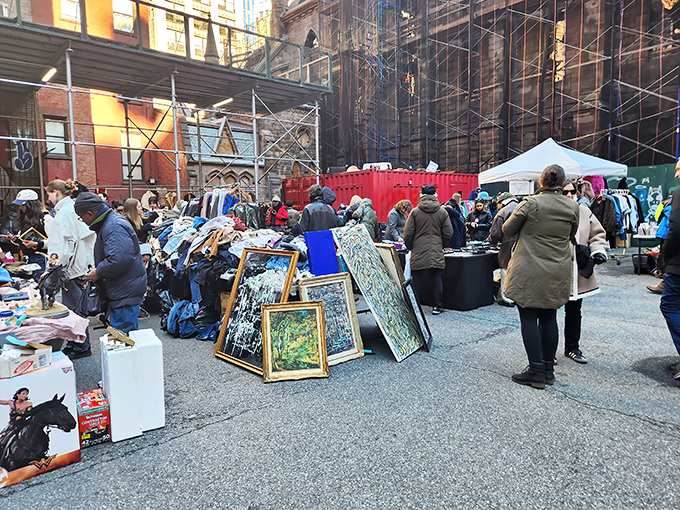 Treasure hunters gather where city streets become outdoor galleries of forgotten dreams and hidden gems.