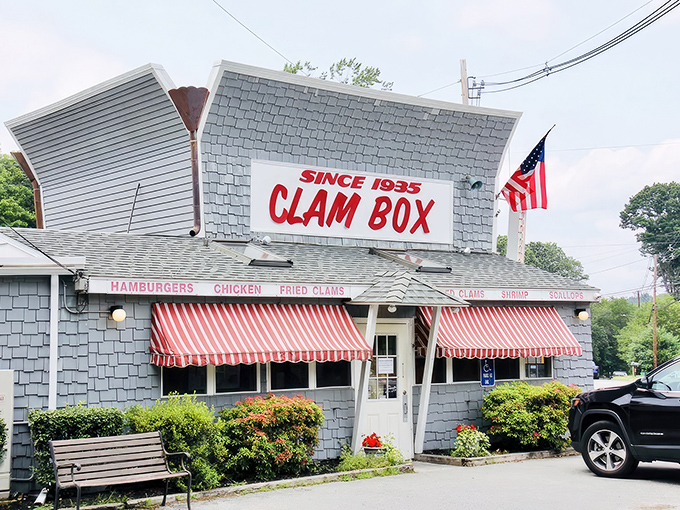 That classic red and white striped awning whispers "authentic New England seafood" louder than any fancy billboard ever could.