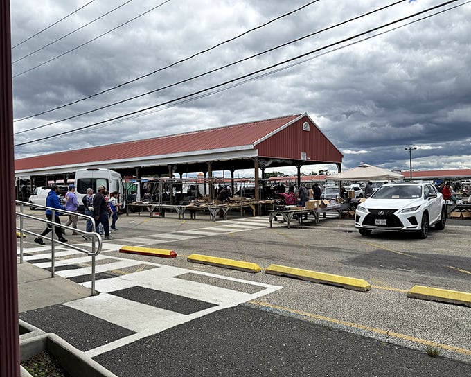 The red-roofed pavilion at Columbus Flea Market stands ready for treasure hunters. Like a bargain bazaar cathedral where deals are practically sacred!
