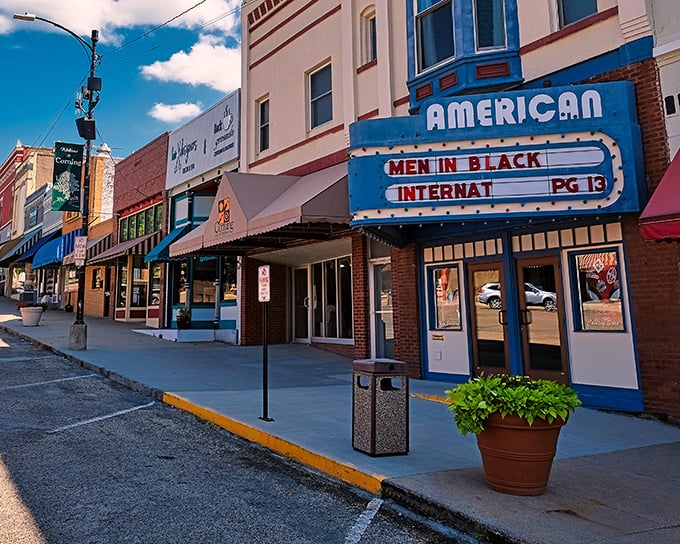 Downtown Corning's historic theater marquee glows with small-town pride and timeless architectural charm worth savoring.