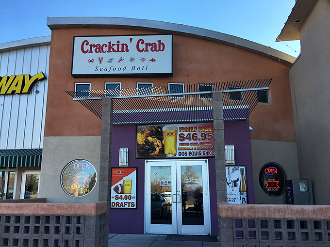The vibrant purple entrance of Crackin' Crab beckons seafood lovers like a desert mirage. Who knew paradise had a neon sign?