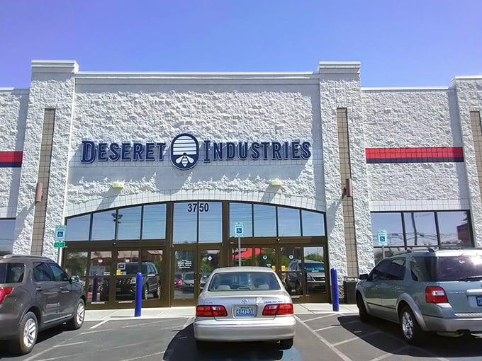 The white facade of Deseret Industries gleams under the Nevada sun, promising treasure hunters a climate-controlled adventure through aisles of possibility.