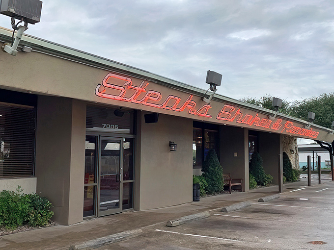 Stone and stucco charm meets neon dreams - this Houston breakfast haven beckons like a warm hug.