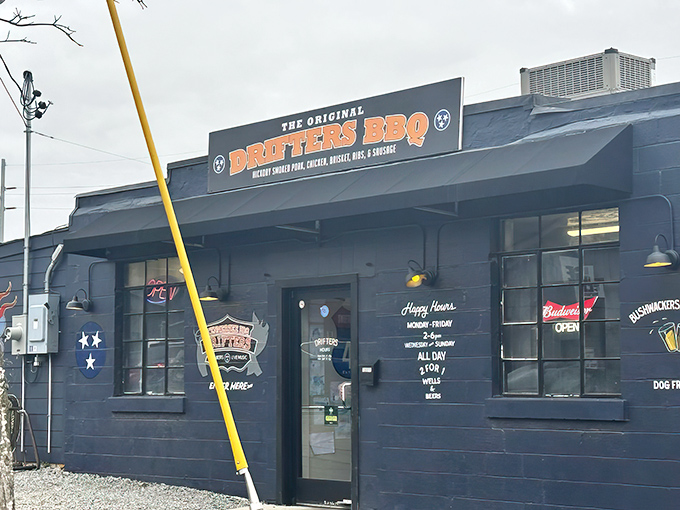 The blue exterior of Drifters BBQ might be unassuming, but that sign promises hickory-smoked heaven waiting just beyond those doors.