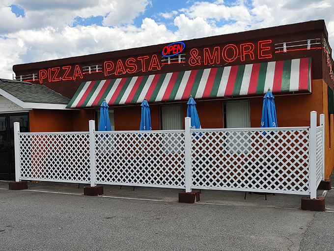 The classic Italian-striped awning at Elizabeth's Pizza promises authentic flavors without the fuss. Pizza paradise awaits!