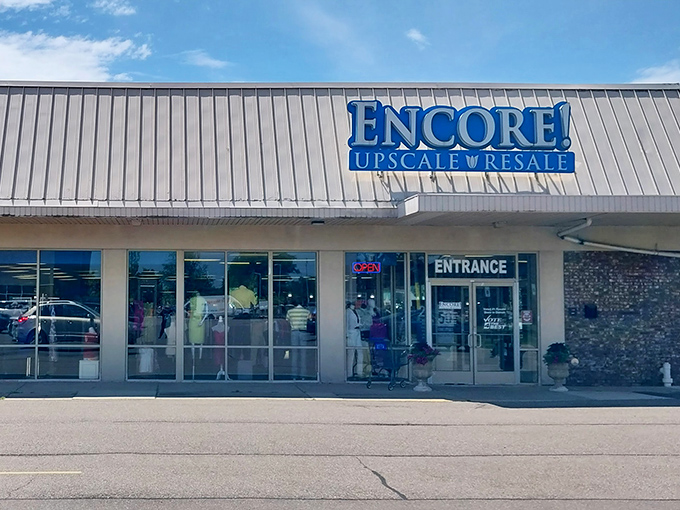 The blue sign beckons like a siren song to bargain hunters. Encore's upscale facade promises treasures within!