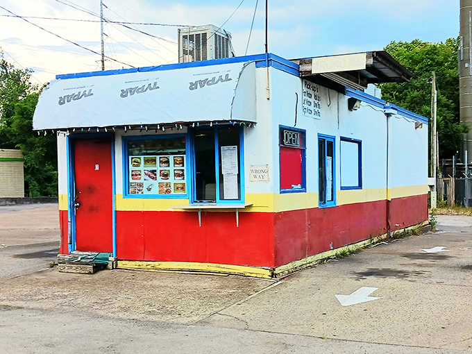 This colorful little corner spot proves the best hot dogs don't need fancy buildings to shine bright.