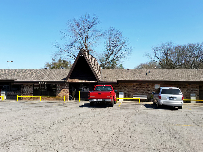 The iconic A-frame entrance of Feltner's Whatta-Burger stands like a burger temple in Russellville. Simple outside, magic inside!
