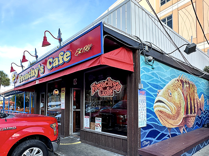 That colorful fish mural practically swims off the wall, promising fresh catches inside this beachside gem.
