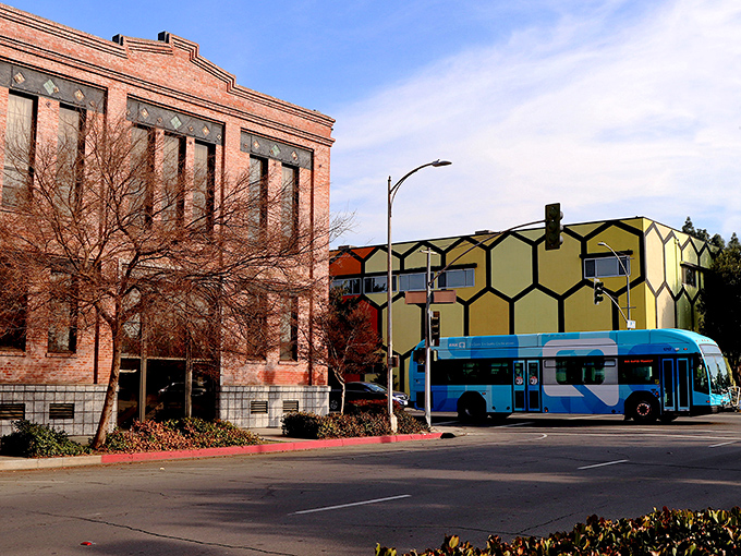 Downtown Fresno's architectural contrast tells a story - historic brick buildings sharing space with honeycomb-inspired modern designs and efficient public transit.