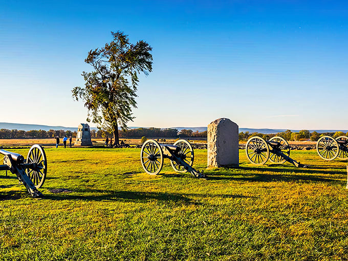 Golden hour transforms this hallowed battlefield into something almost cinematic, where history whispers through every cannon wheel.