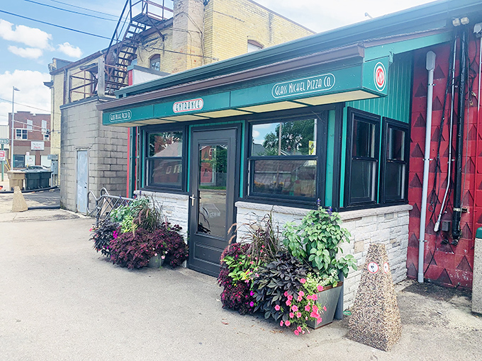 That green awning beckons like a lighthouse for pizza lovers seeking their perfect slice sanctuary.