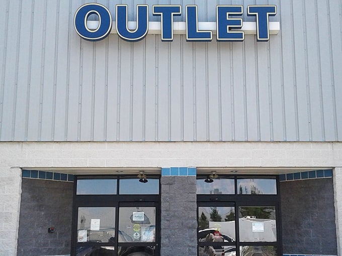 The Goodwill Outlet sign beckons like a lighthouse to bargain hunters navigating the sea of retail options.
