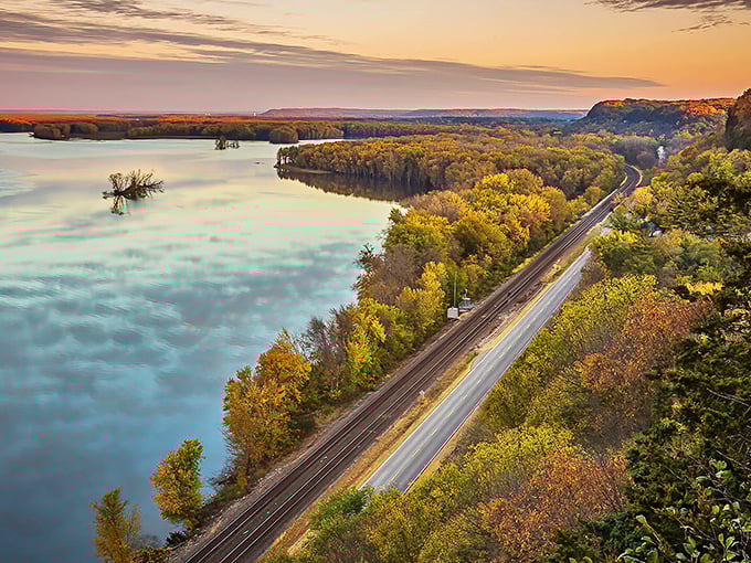Sunset paints the Mississippi River gold as it winds alongside the Great River Road. Nature's light show at its finest!