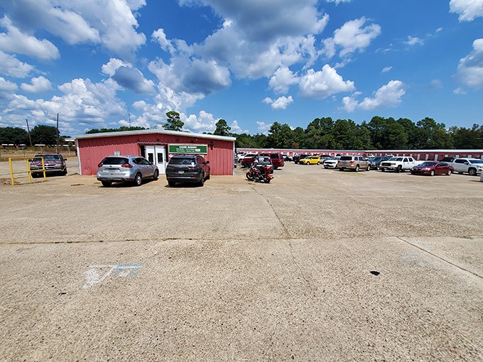 The red building stands ready like a treasure chest waiting to be opened by eager bargain hunters.