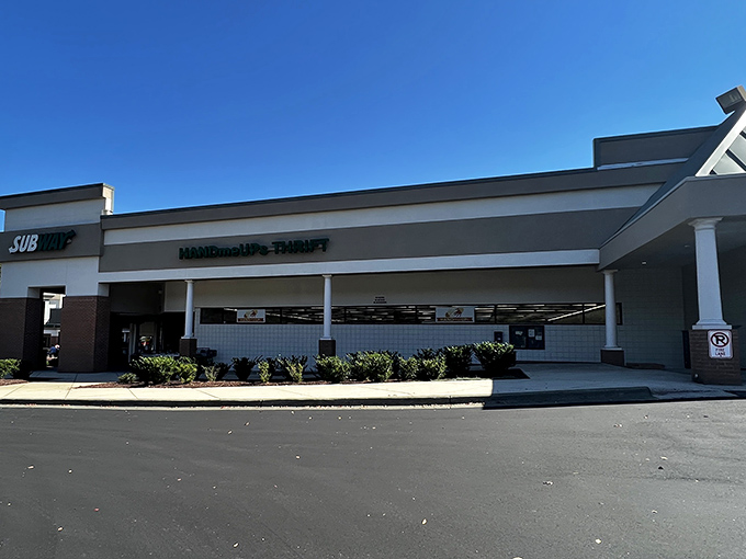 The unassuming storefront of HandmeUPs Thrift hides a treasure trove within. Like finding the wardrobe to Narnia, but with vintage sweaters instead of snow.