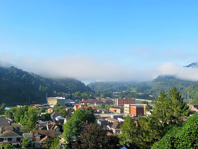 Morning mist hugs Harlan like a gentle embrace, revealing a mountain town that time forgot.