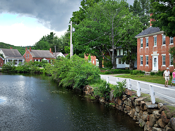 Harrisville's historic mill buildings reflect in the pond like a New England postcard come to life.