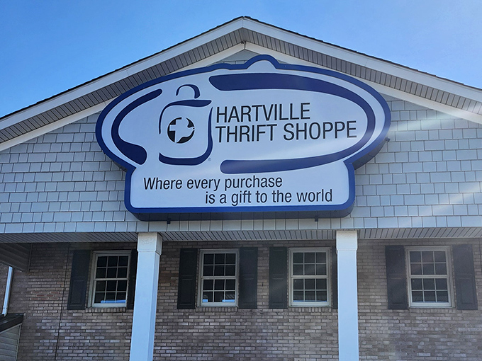 The Hartville Thrift Shoppe sign promises every purchase helps the world. Treasure hunting with a conscience!