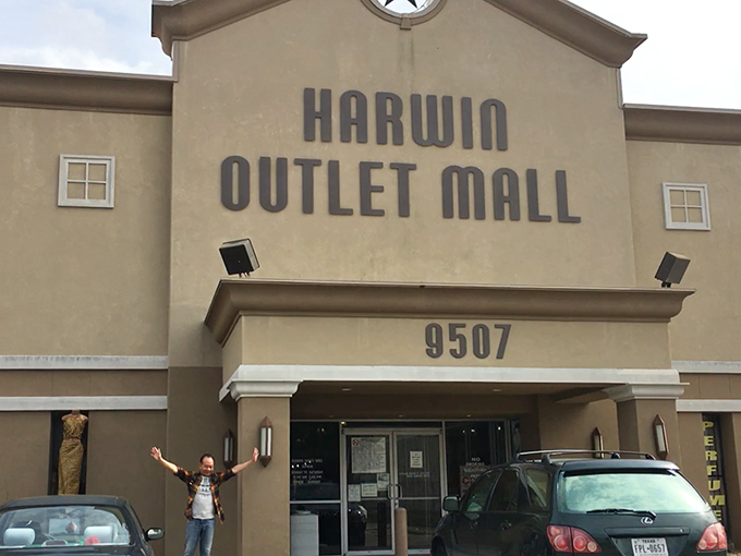 Look at that victory pose! Nothing says "I conquered the bargain hunt" like arms raised triumphantly outside Houston's treasure trove.