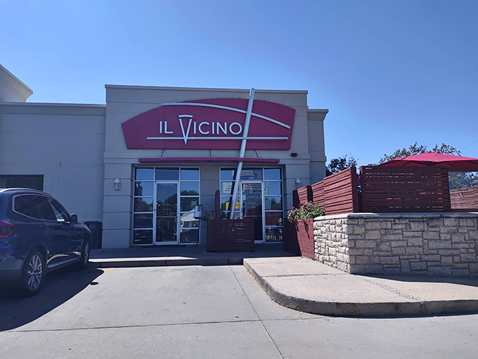 Il Vicino's bold red sign promises wood-fired delights within. Like a pizza lighthouse guiding hungry sailors home!
