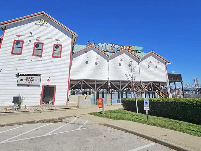 Joe's Crab Shack stands proud along the Ohio River, a white-washed seafood sanctuary where crab legs and good times await.