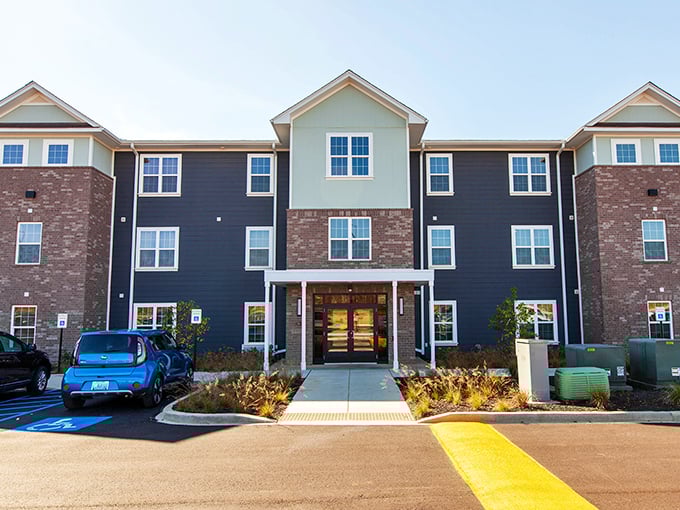 Modern comfort meets smart budgeting at this welcoming entrance where retirement dreams don't require lottery winnings.