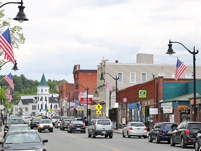 Main Street magic unfolds where American flags dance above brick buildings like patriotic confetti.