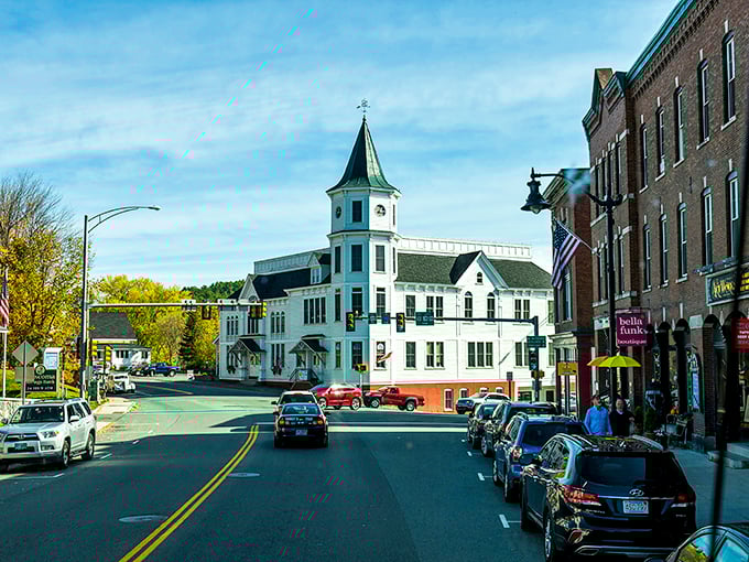 Littleton's iconic Opera House stands like a proud timekeeper, watching over Main Street with its classic New England charm.