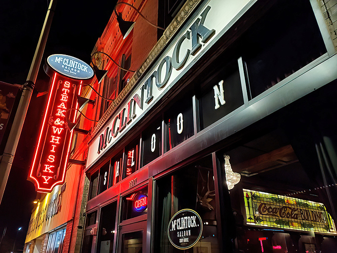 That neon glow says "serious steaks ahead" - McClintock's vintage saloon vibes never go out of style.