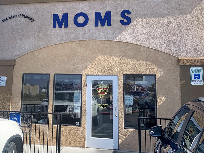 Mom's Diner exterior welcomes hungry travelers with its bold blue lettering – "The Heart of Pahrump" isn't just a slogan, it's a promise.