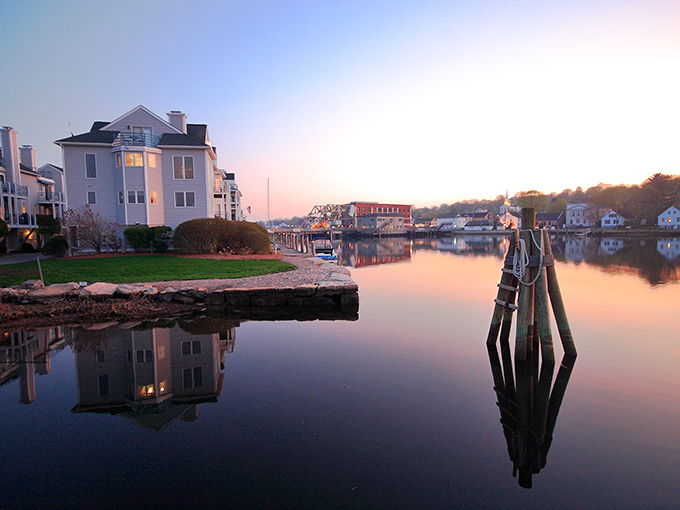 Mystic's waterfront at sunset creates a mirror-like reflection that would make even Monet reach for his paintbrush.