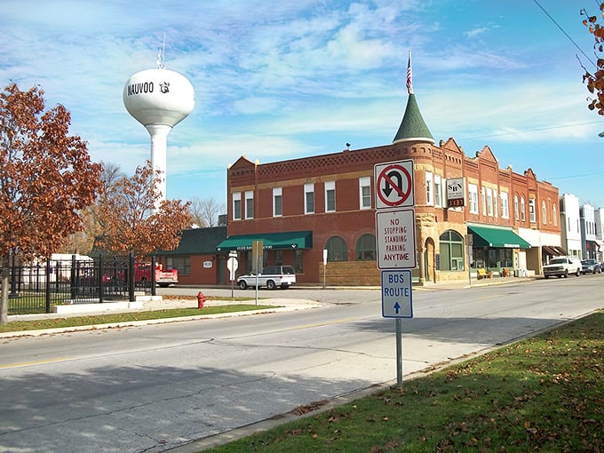 Where small-town charm meets big sky country! Nauvoo's iconic water tower watches over brick buildings that have seen more seasons than a Netflix drama.
