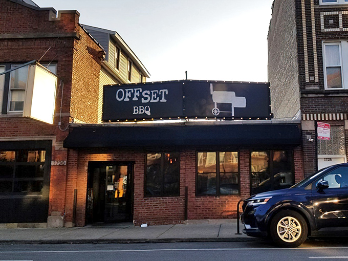 The brick facade of Offset BBQ might look unassuming, but that simple black sign marks the spot where smoke dreams come true.