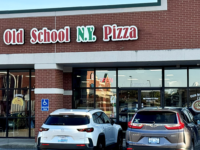 The bright red and green sign of Old School N.Y. Pizza promises authentic slices that'll transport you straight to the Big Apple.