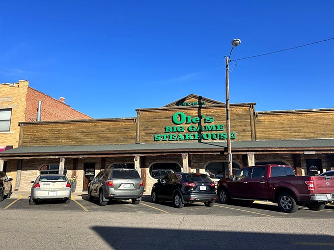 That green neon sign beckoning like a lighthouse for hungry travelers on Highway 80.