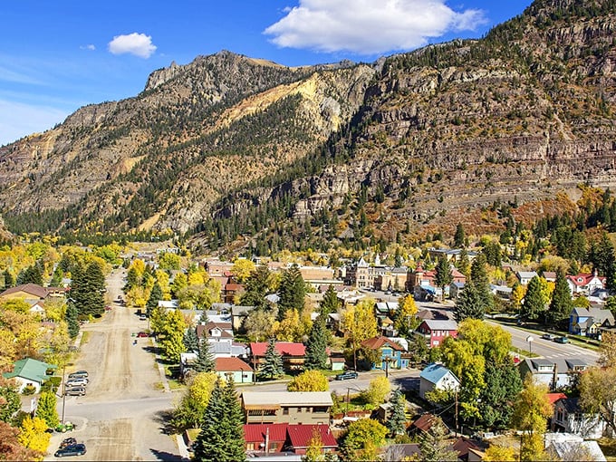 Ouray nestles in its box canyon like a precious gem in nature's jewelry box, surrounded by towering peaks.