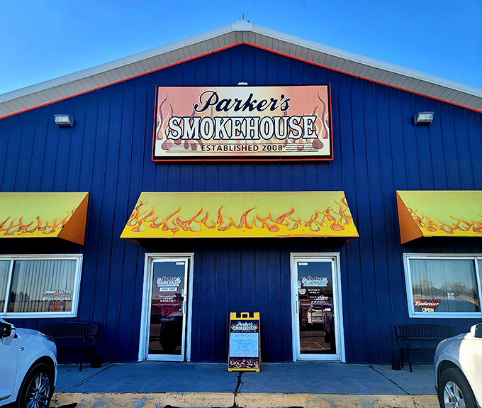 That bright blue building with flame awnings isn't hiding - it's announcing serious barbecue business ahead.