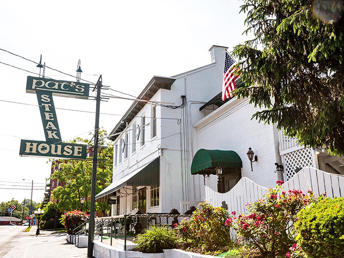 Classic steakhouse charm meets American pride with flowers blooming like your appetite will inside.