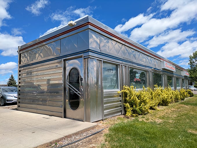 Classic Americana shines in this chrome diner exterior, where nostalgia comes wrapped in stainless steel and served 24/7.