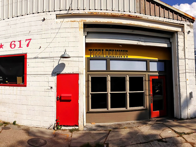 The bright red door at Pizza Delicious beckons like a portal to New York-style heaven in the heart of New Orleans.