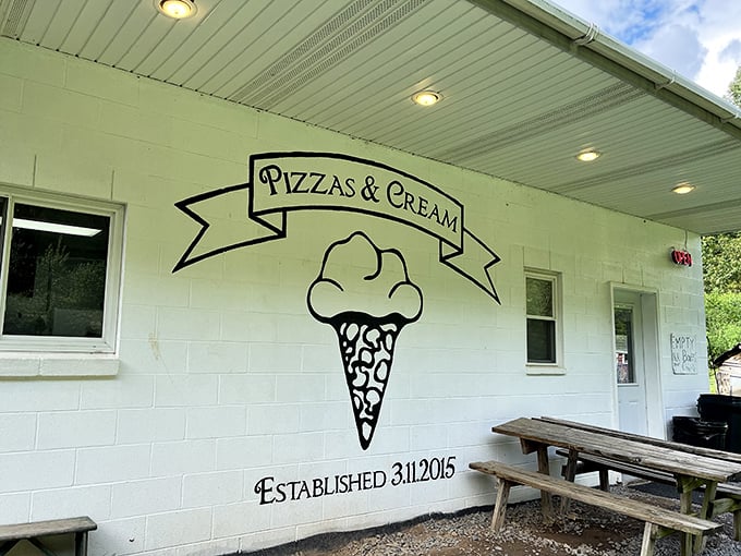 Sometimes the best treasures hide behind the simplest facades - this unassuming white building holds pizza magic.