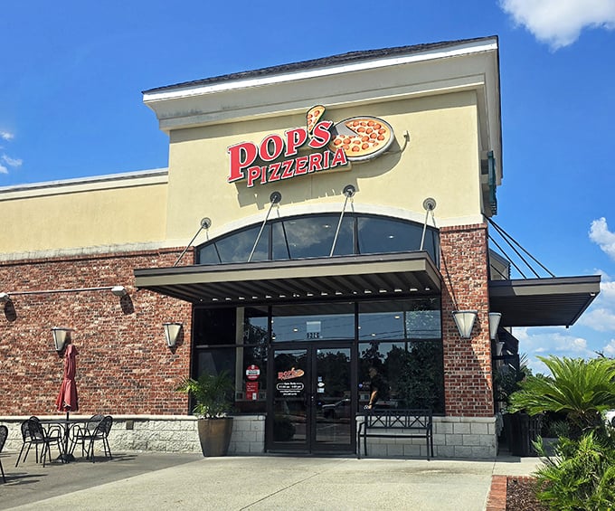 Pop's Pizzeria beckons with sunny yellow walls and that unmistakable aroma of fresh dough dancing through the air.