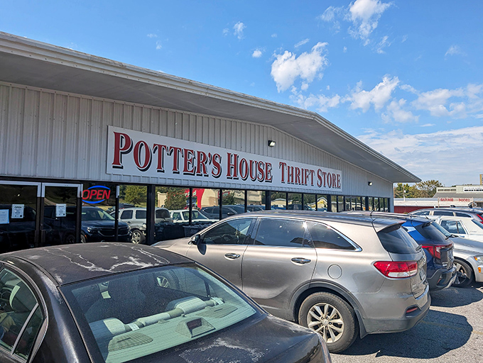 Potter's House Thrift Store beckons with its bold red sign, promising treasure hunters a day of discoveries behind those doors.