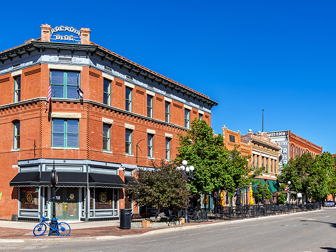 Historic red brick buildings line these charming streets where every dollar stretches like Sunday afternoon naps.
