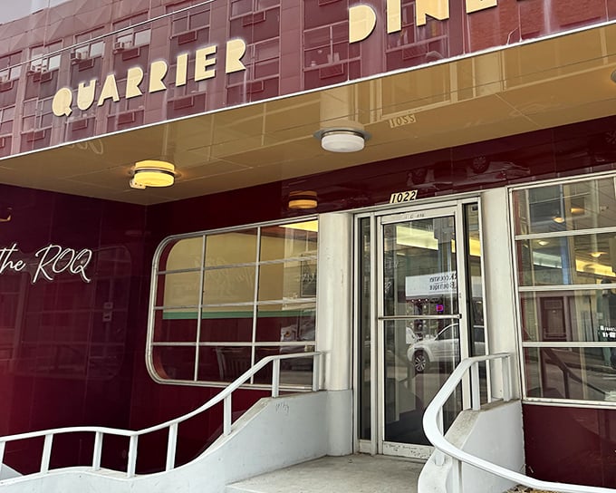 The iconic burgundy facade of Quarrier Diner beckons like a time machine to the golden age of American diners. Classic never goes out of style!