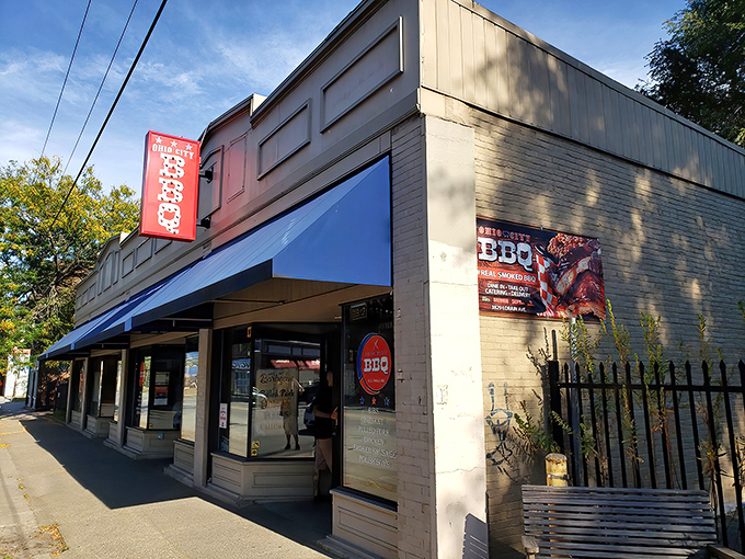 The unassuming storefront of Real Smoq'ed BBQ hides Cleveland's BBQ treasure. Blue awnings and brick walls - culinary magic happens inside!