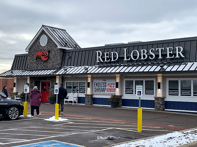 Red Lobster's iconic stone facade welcomes seafood lovers like a lighthouse beckoning ships to shore.