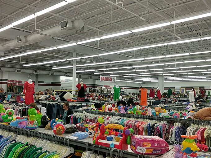 Inside Red White & Blue Thrift Store: A treasure hunter's paradise where racks of colorful clothing stretch as far as the eye can see.